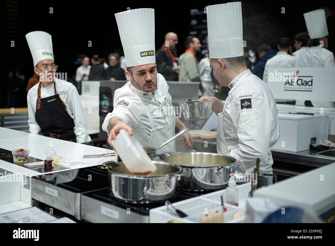 Great Britain's chef Tom Phillips, center, prepares food during the ...