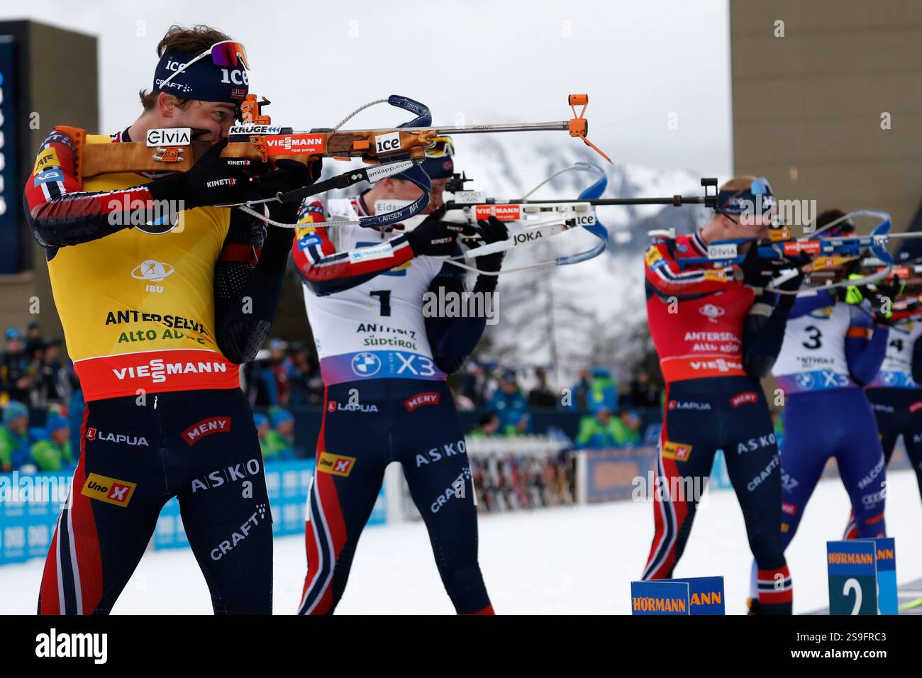 Norway's Holm Laegreid Sturla, left, competes during a Biathlon men's ...
