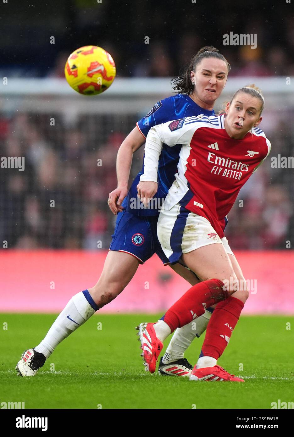 Arsenal's Alessia Russo (right) and Chelsea's Niamh Charles battle for ...