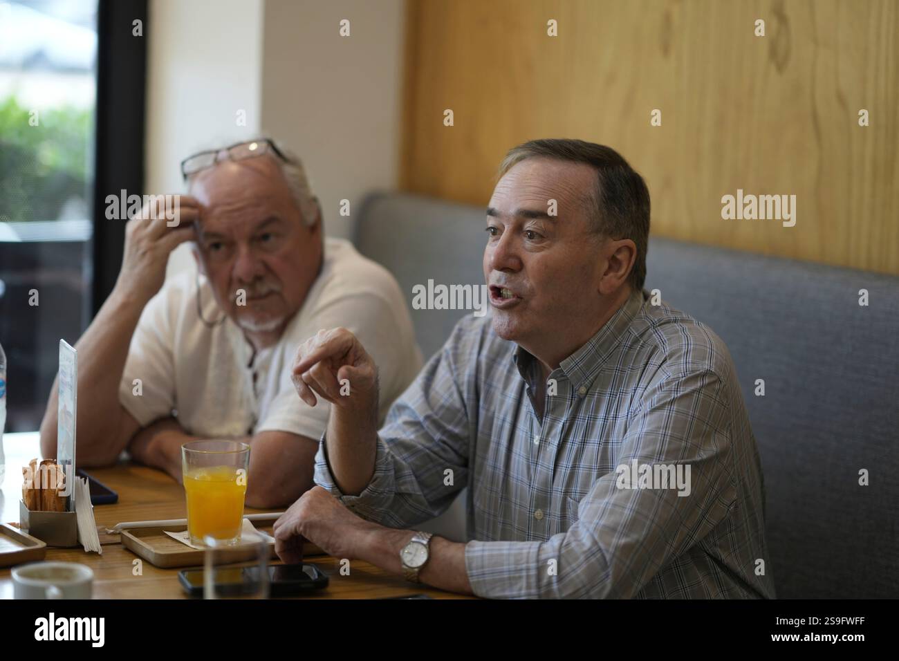 Dr. Alfredo Boccia, right, a researcher on Paraguay's history, talks ...