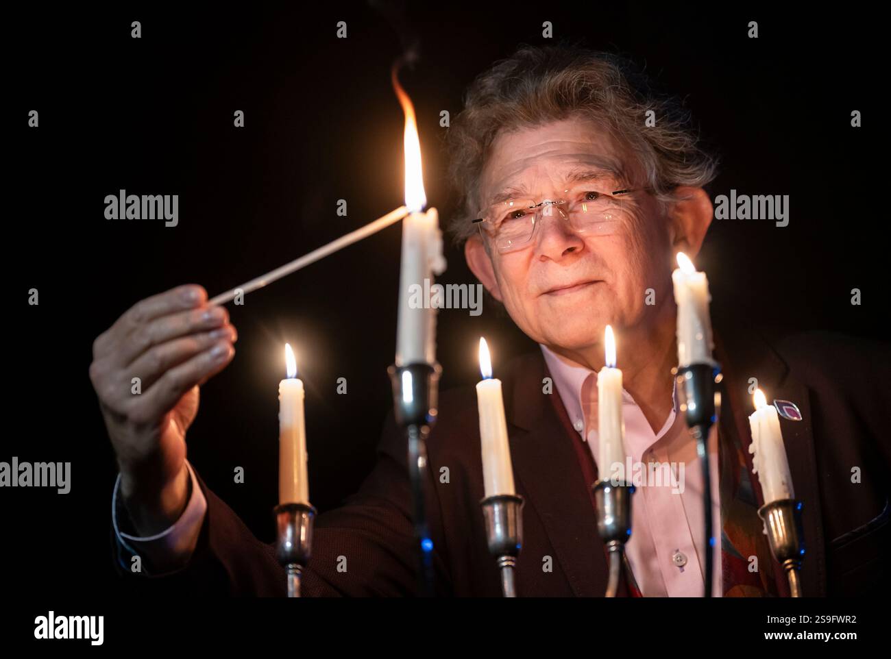 Nick Winton, son of Sir Nicholas Winton, lights a candle ahead the ...