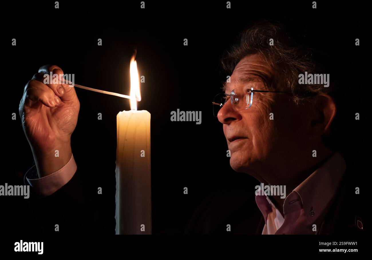 Nick Winton, son of Sir Nicholas Winton, lights a candle ahead the ...