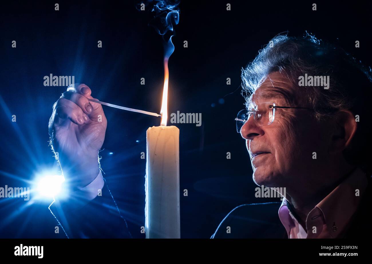 Nick Winton, son of Sir Nicholas Winton, lights a candle ahead the ...