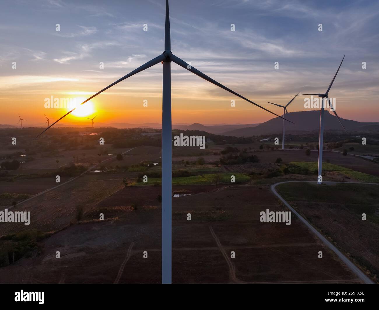 Wind farm field and sunset sky. Wind power. Sustainable, renewable ...