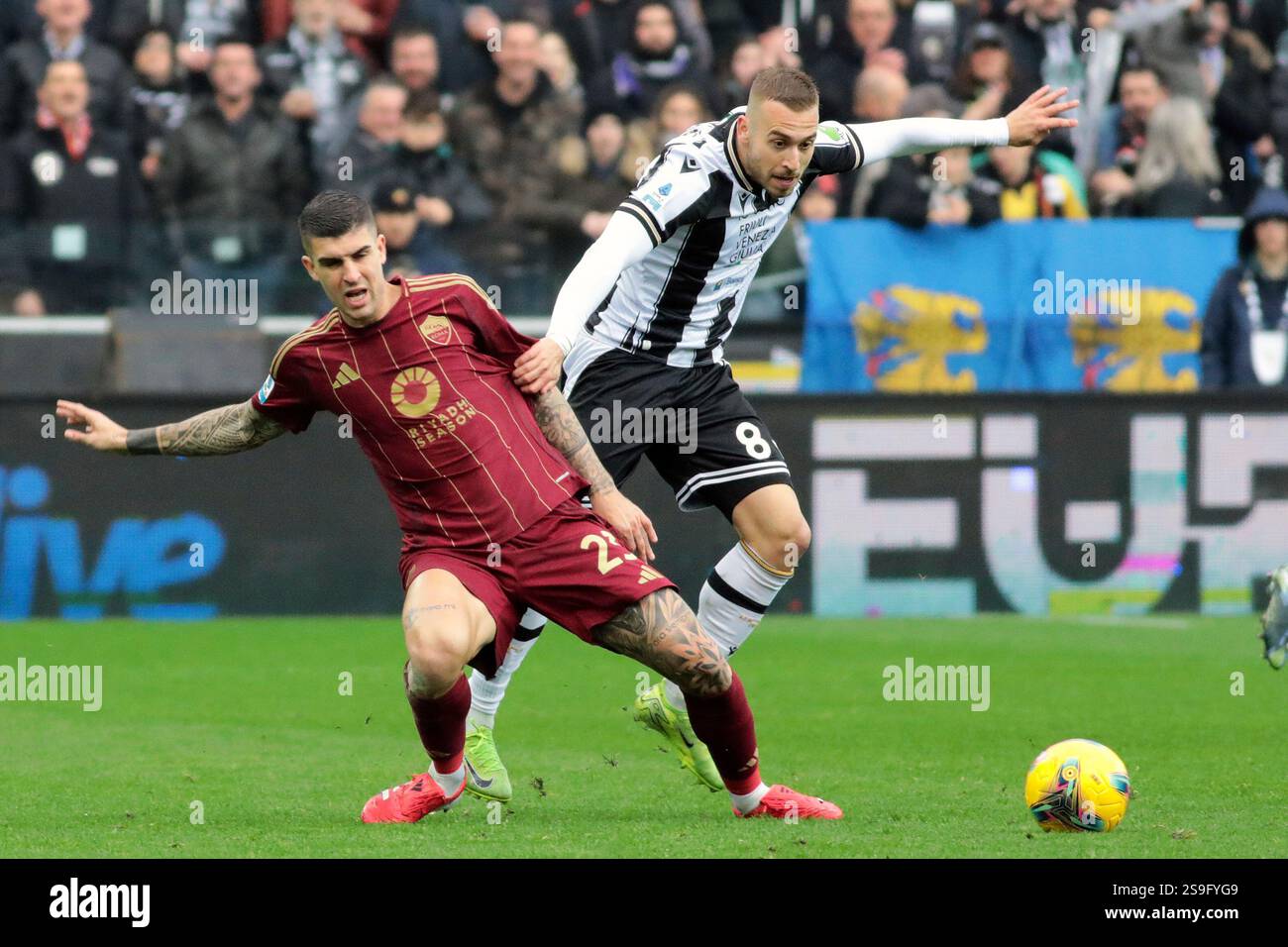 Roma's Gianluca Mancini, left, and Udinese's Sandri Lovric in action ...