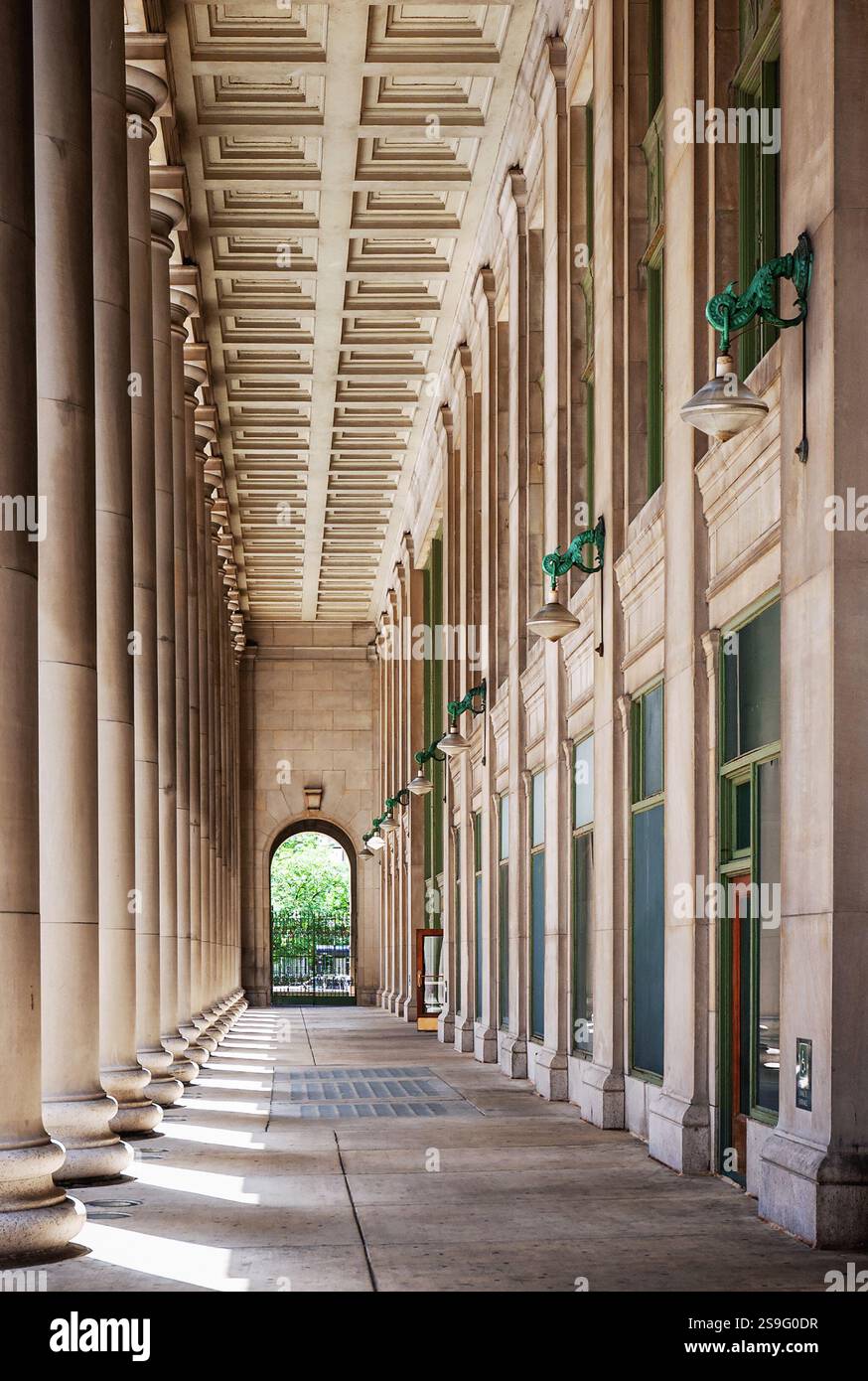 View of a classic architectural colonnade featuring tall pillars and ...