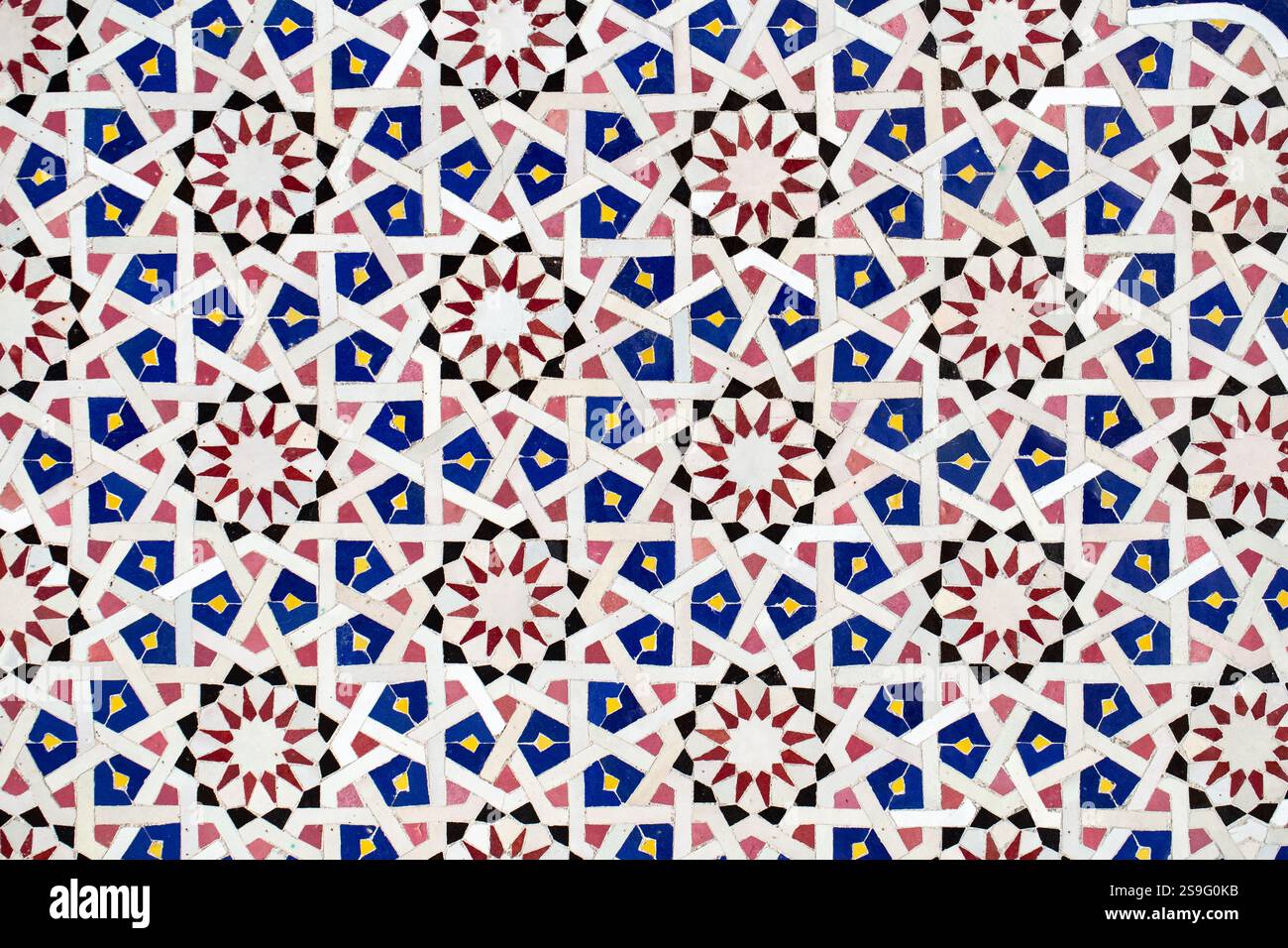 A detailed Islamic geometric mosaic featuring vibrant colors and ...