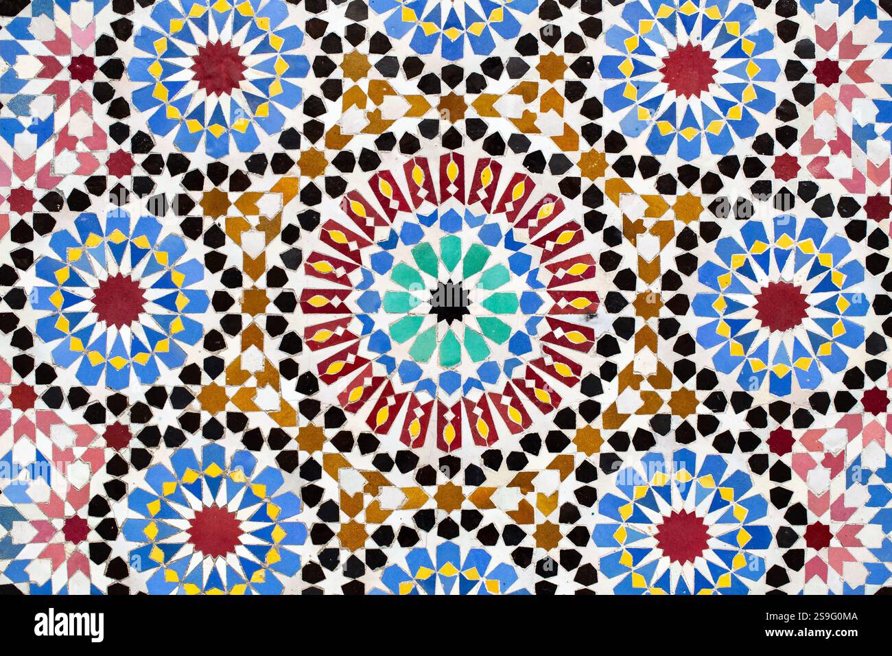 A detailed Islamic geometric mosaic featuring vibrant colors and ...