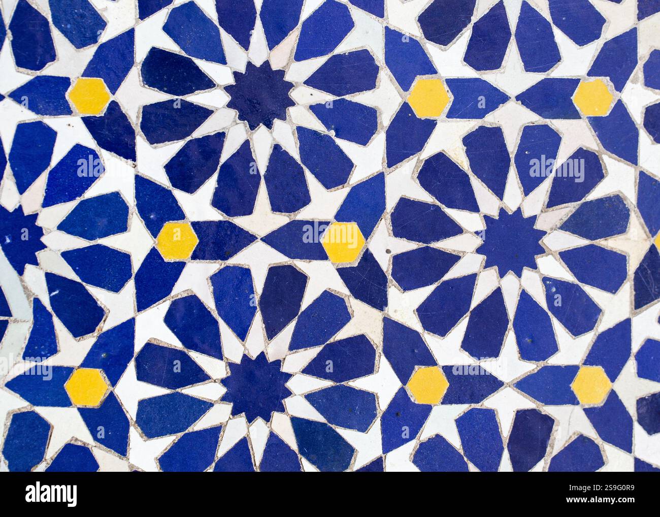 A detailed Islamic geometric mosaic featuring vibrant colors and ...
