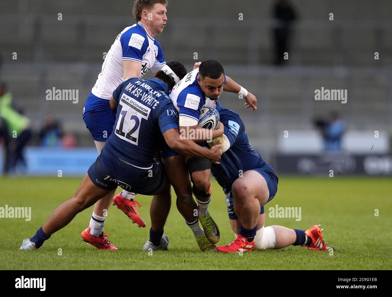 Bath's Joe Cokanasiga is tackled by Sale Sharks' WillGriff John (right ...