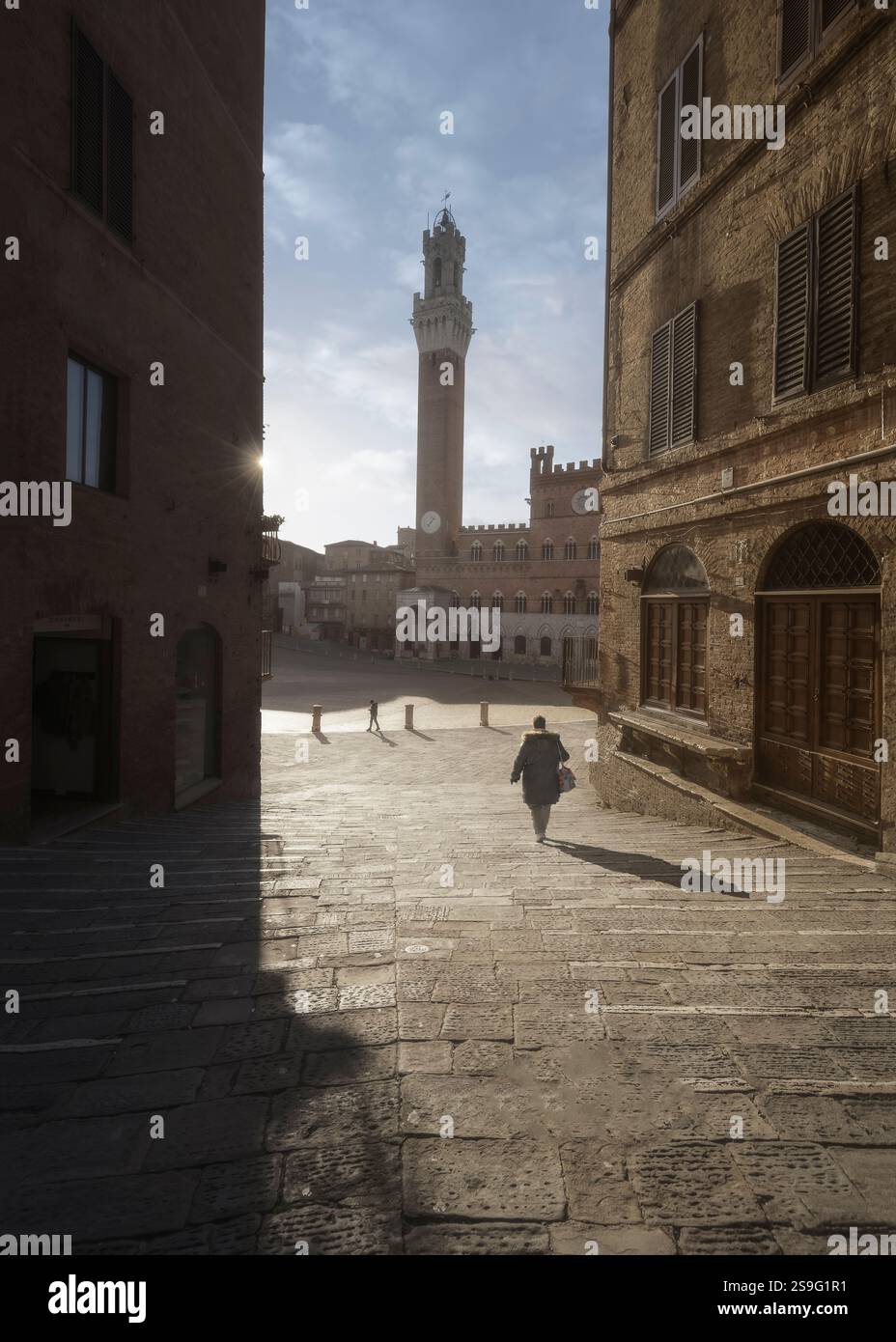 A mesmerizing nighttime view of Assisi, Italy, with its historic stone ...