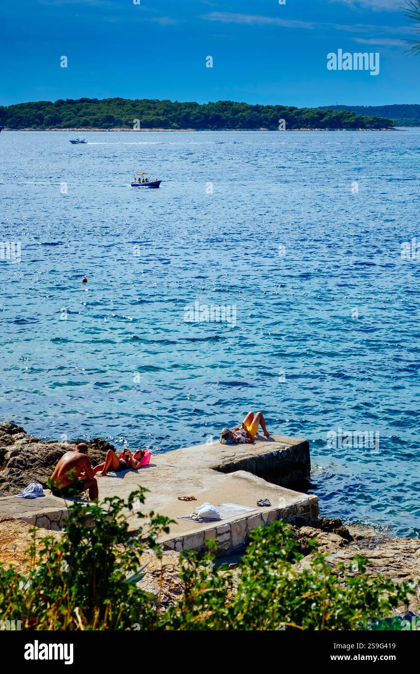 Sunbathers, Hvar, Croatia, Adriatic Stock Photo - Alamy