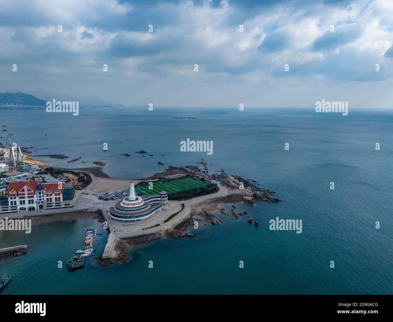 An aerial view of a soccer pitch built on a land stretching into the ...