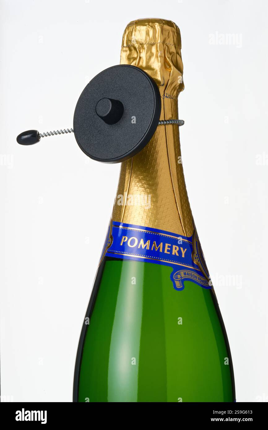 Wine bottle with a security tag fixed to the neck Stock Photo - Alamy