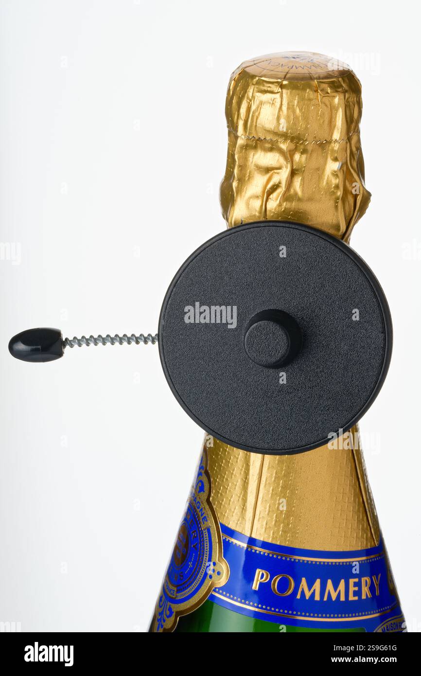 Wine bottle with a security tag fixed to the neck Stock Photo - Alamy
