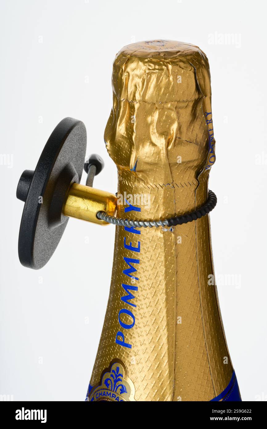 Wine bottle with a security tag fixed to the neck Stock Photo - Alamy