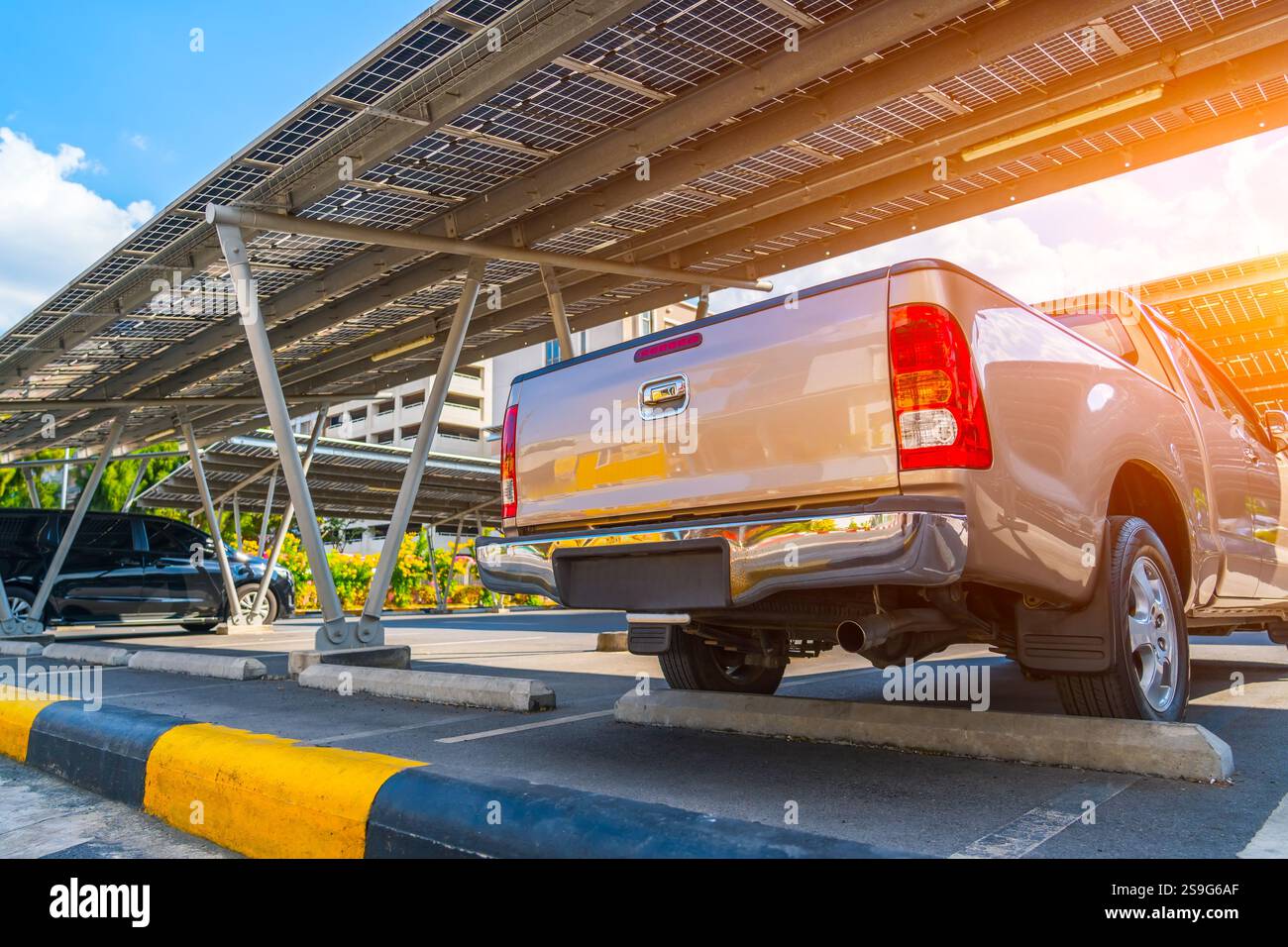 Car parking with canopy roof with solar panels. Solar power generation ...