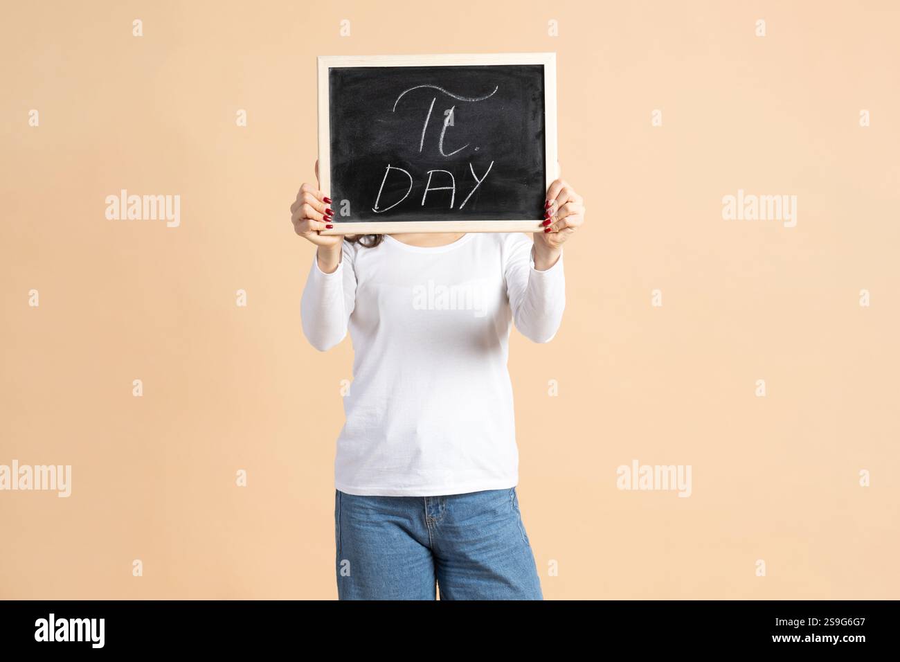 Back to school, international Pi day concept. Woman holding and ...