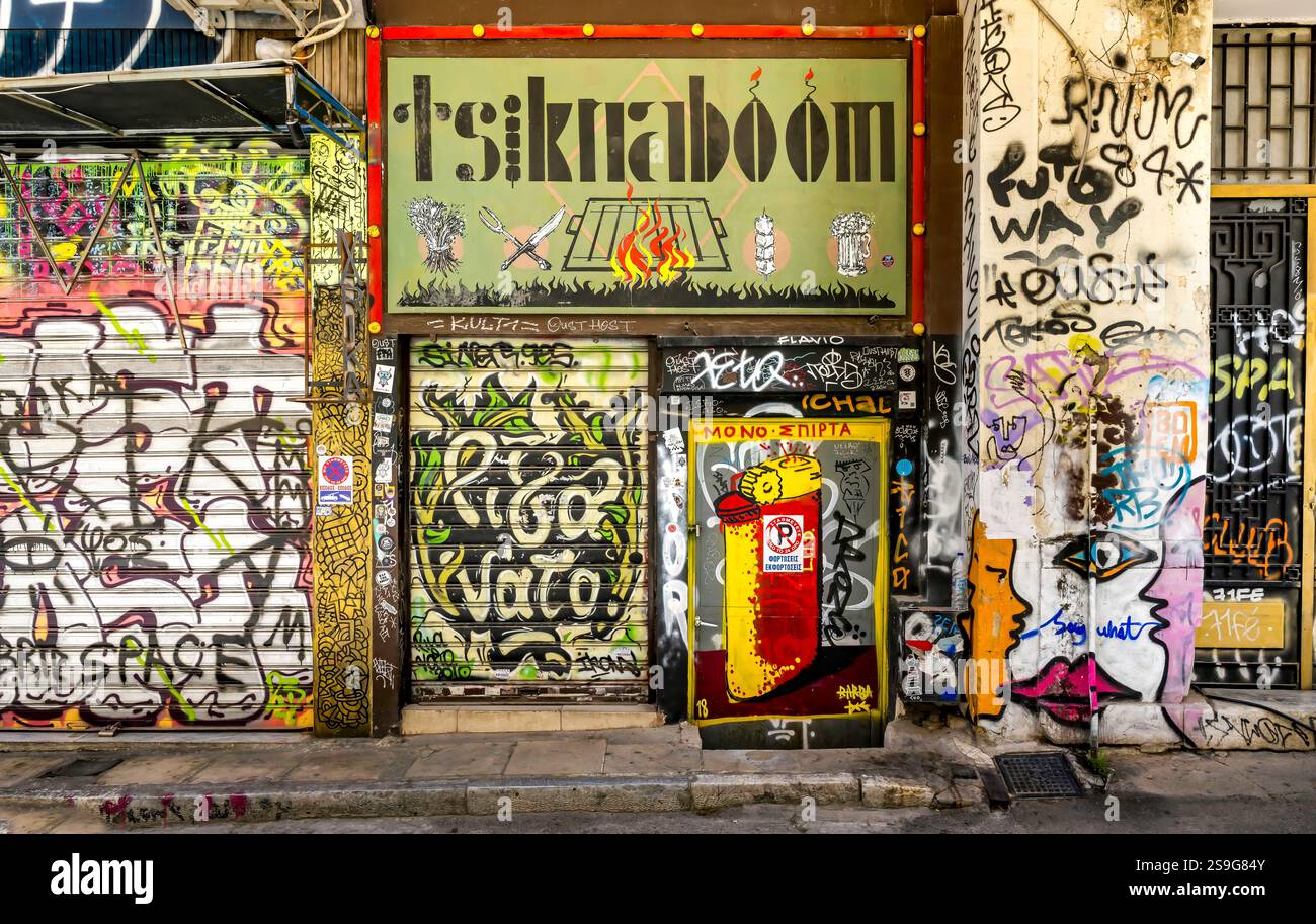 Colorful graffiti and artistic designs covering a storefront with ...