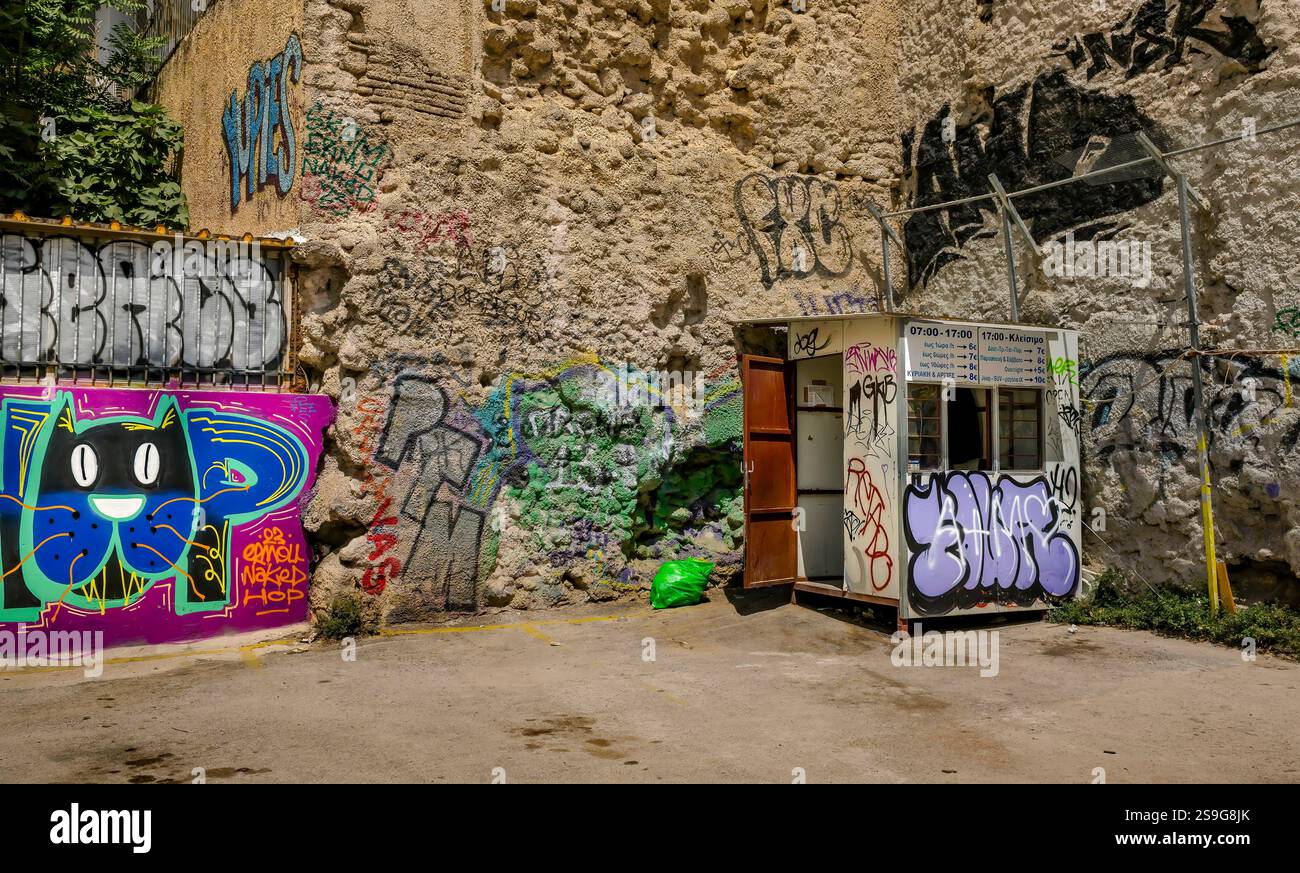 Colorful graffiti adorns the walls of an urban setting featuring a ...