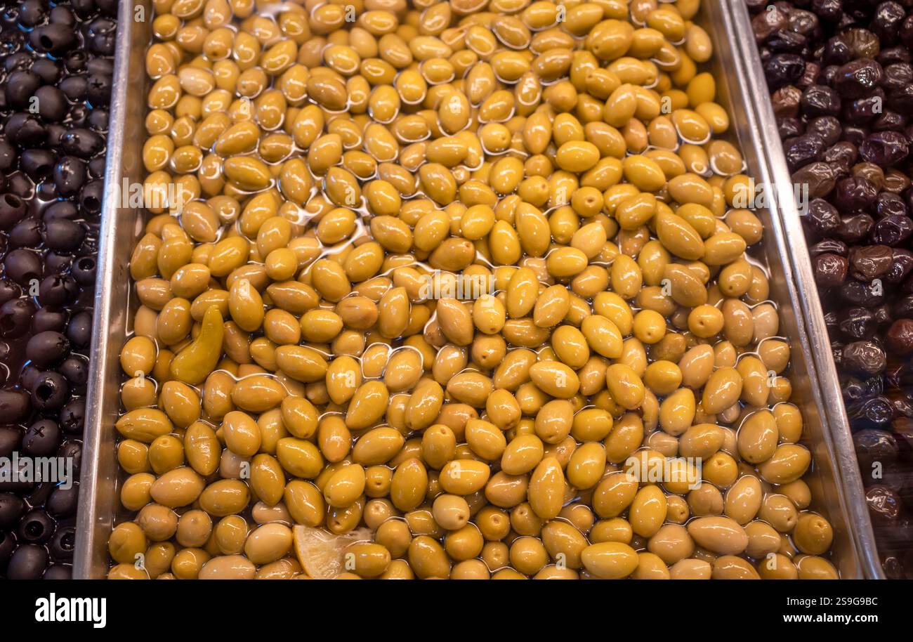 Fresh Olive fruits at a container in a supermarket in Mecca, Saudi ...