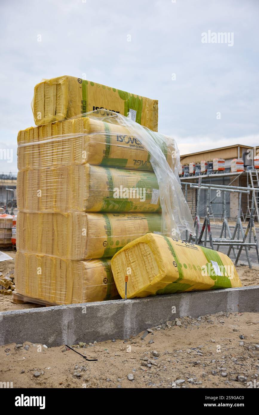Pile of plastic-wrapped insulation material in construction site Stock ...