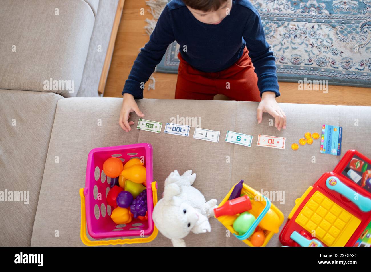 A child plays store with toy money Stock Photo - Alamy