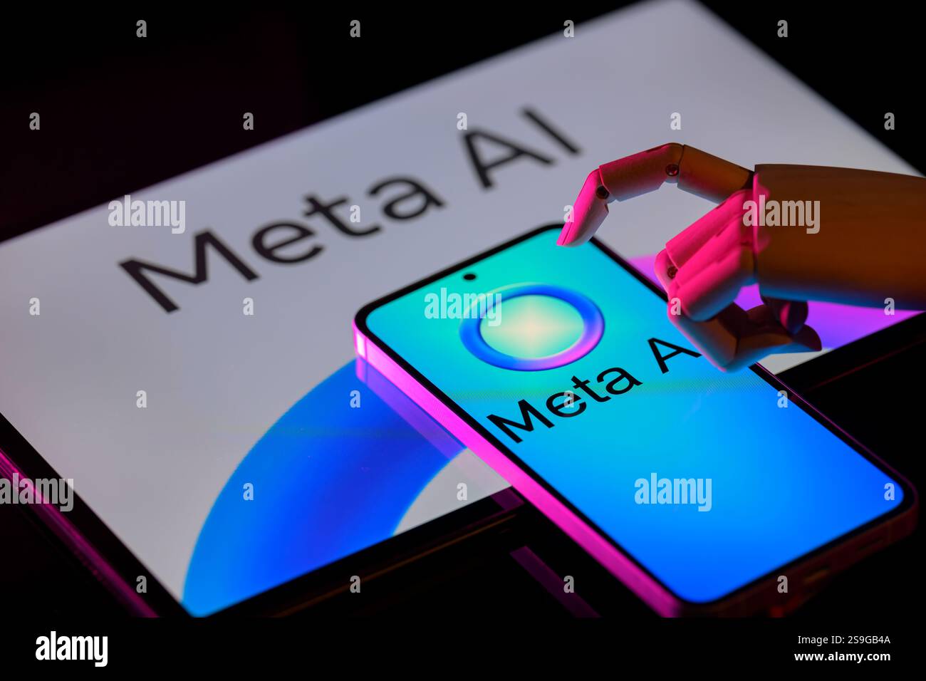 Meta AI logo is displayed on a mobile phone with Meta AI seen on tablet ...