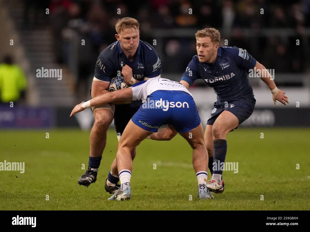 Sale Sharks' Jean-Luc du Preez (left) is tackled by Bath's Nye Thomas ...