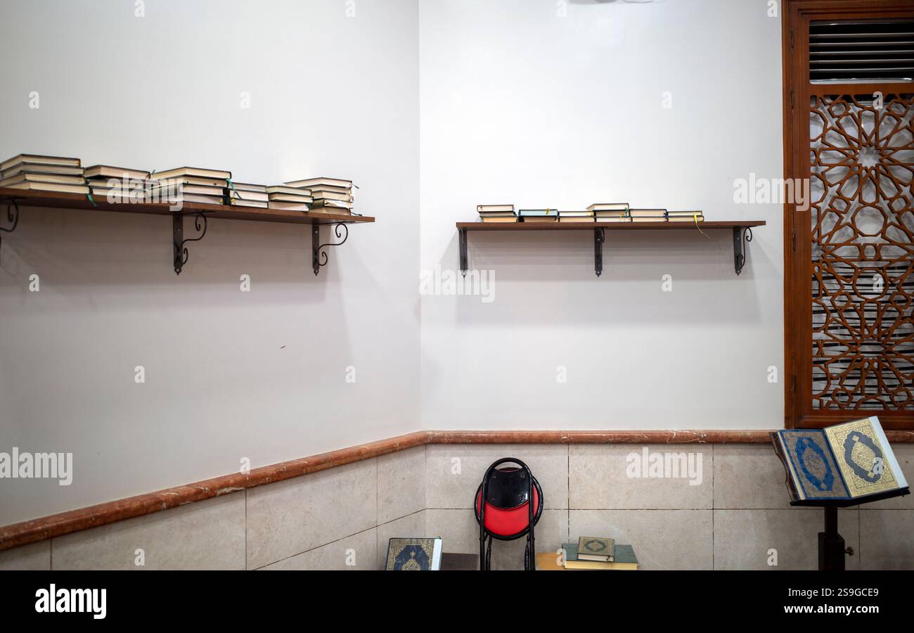 The wall of a mosque in Mecca, Saudi Arabia with the Holy Quran on a ...