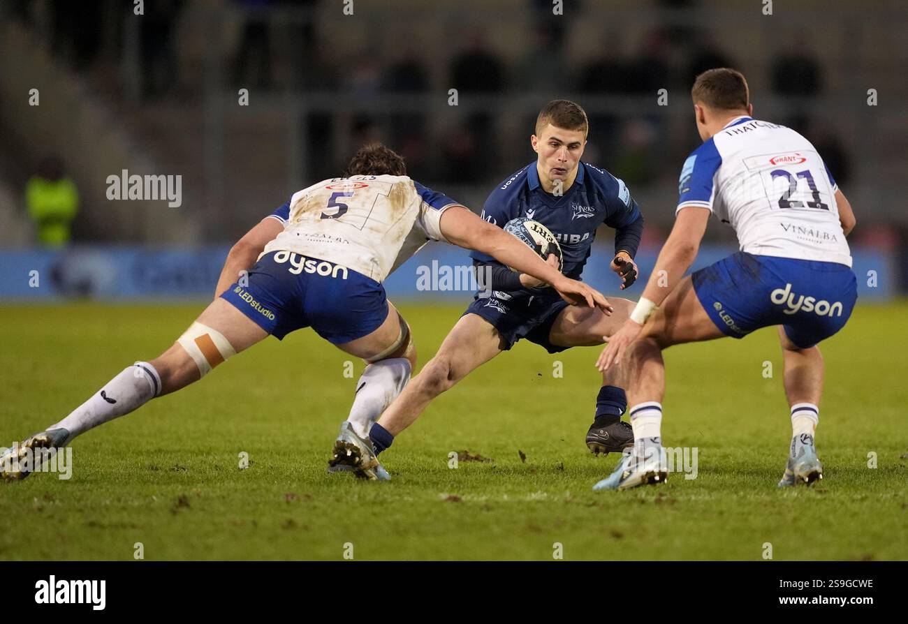 Sale Sharks' Nye Thomas in action with Bath's Charlie Ewels (left) and ...