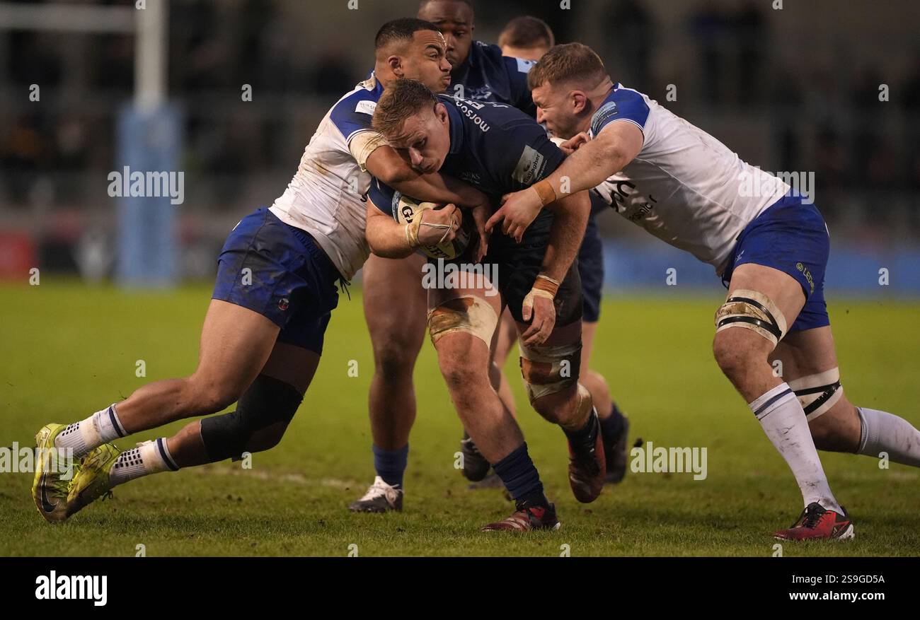 Sale Sharks' Jean-Luc du Preez is tackled by Bath's Max Ojomoh (left ...