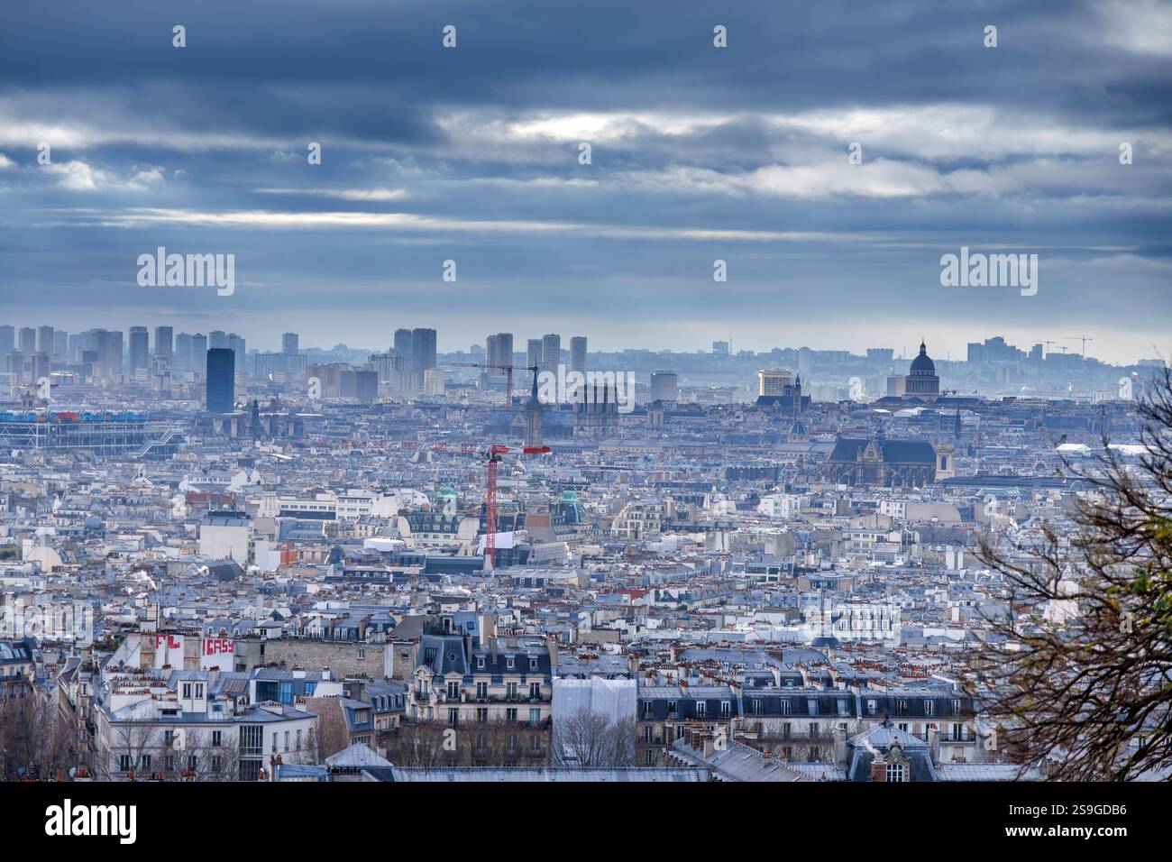 Panoramic view of Paris cityscape with cloudy skies, featuring iconic ...