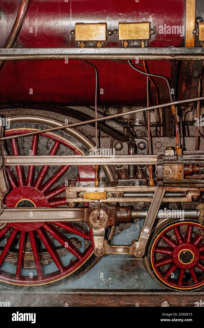 Close up of a narrow gauge steam locomotive's running gear and coupling ...