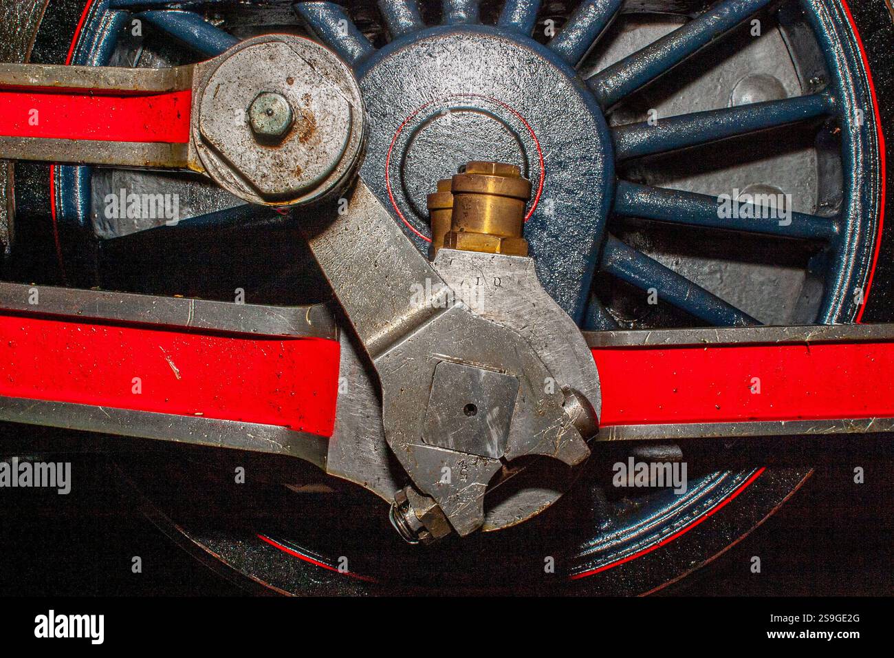Close up of a narrow gauge steam locomotive's running gear and coupling ...