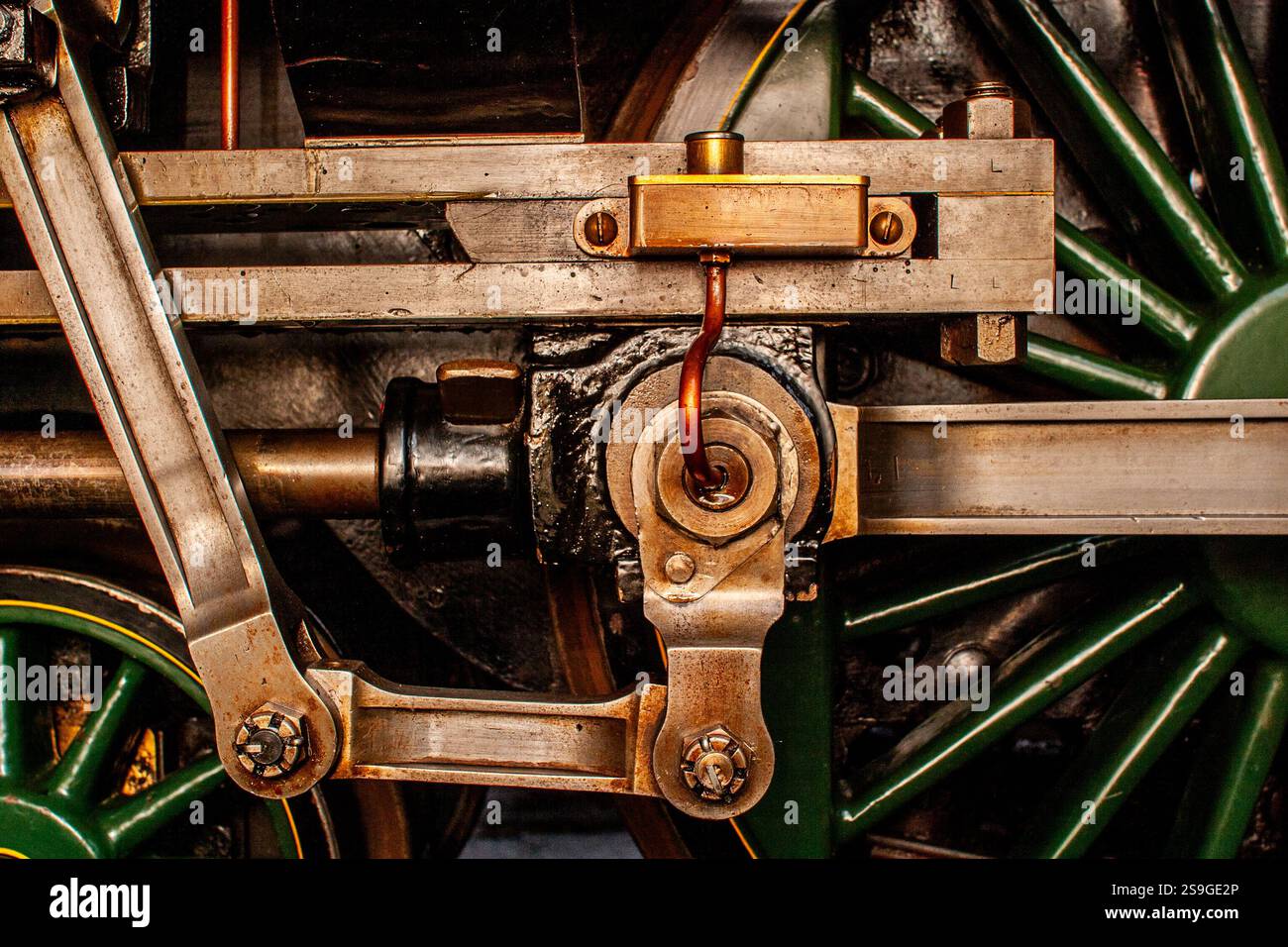 Close up of a narrow gauge steam locomotive's running gear and coupling ...