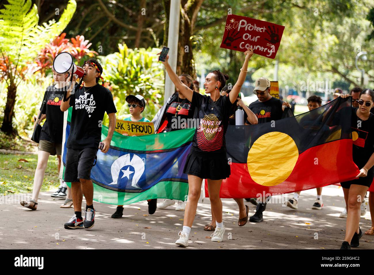 Cairns, Australia. 26th Jan, 2025. Demonstrators march through the ...