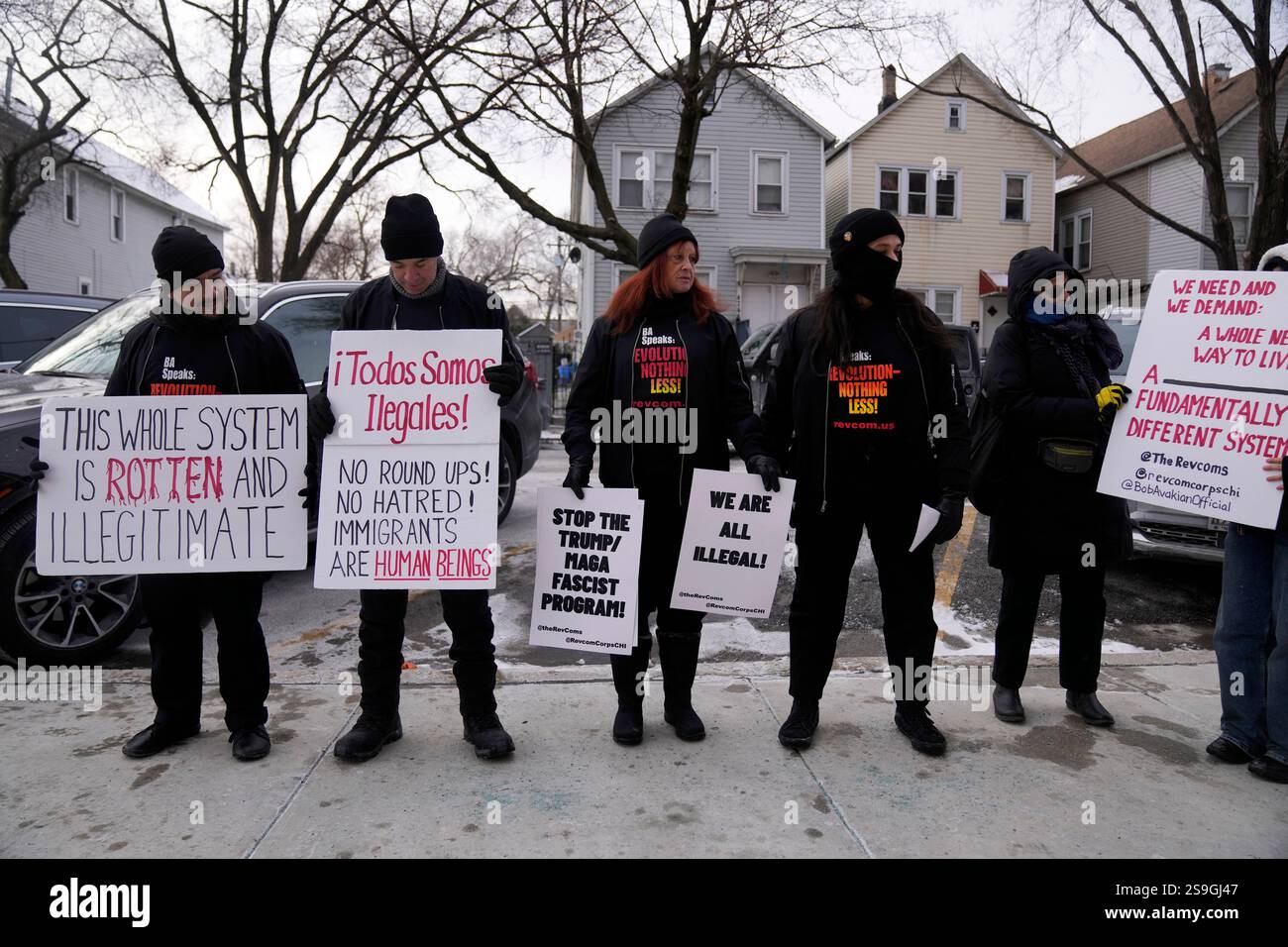 FILE - Activists with Revcom Corps Chicago hold signs outside of ...
