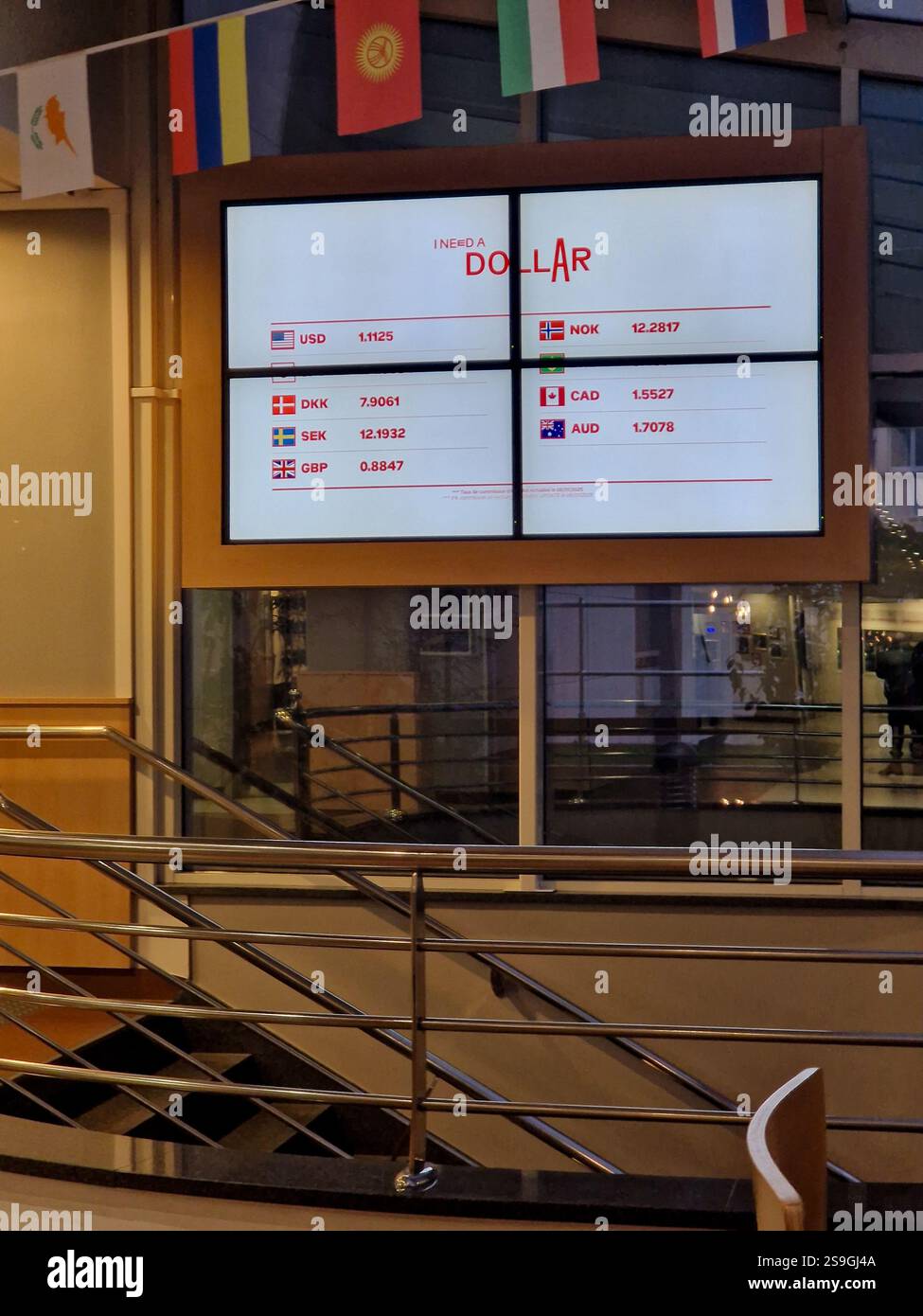 Stock Market prices on a large TV screen in a hotel lobby, Paris ...