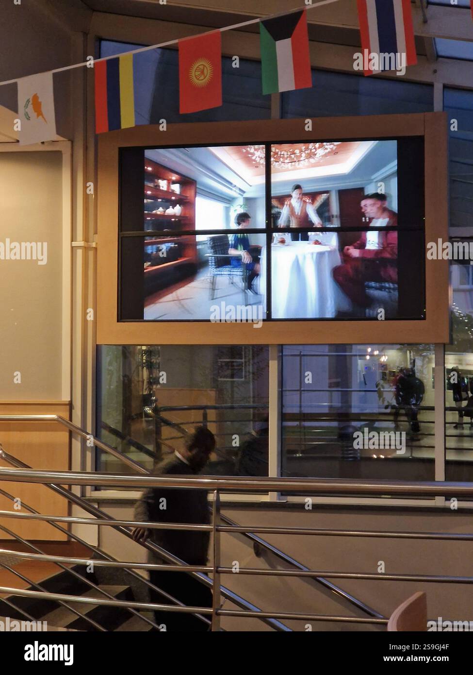 Large TV screen in a hotel lobby, Paris, France Stock Photo - Alamy