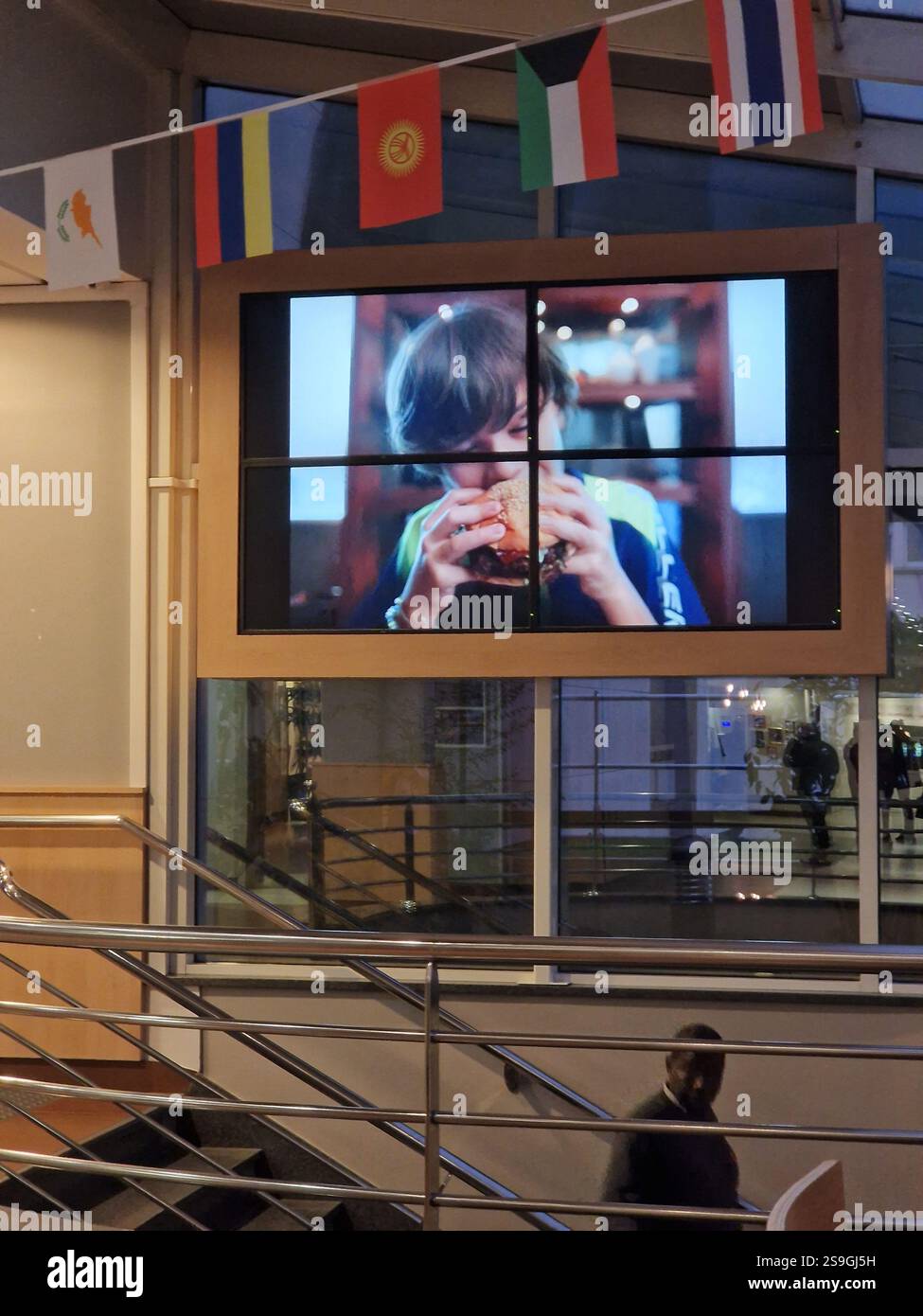 Large TV screen in a hotel lobby, Paris, France Stock Photo - Alamy