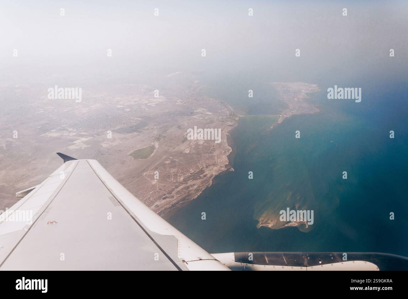 View from the window of the aircraft window on the wing and ground from ...
