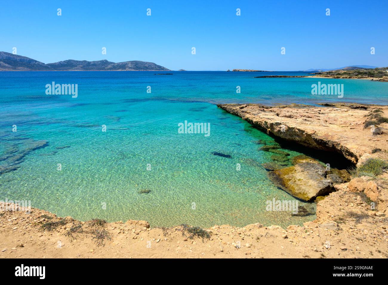 Ano Koufonisi beach with rocks and azure sea water. Small Cyclades ...