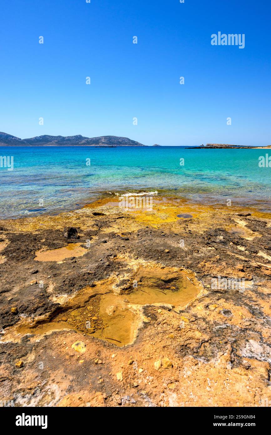 Ano Koufonisi beach with rocks and azure sea water. Small Cyclades ...