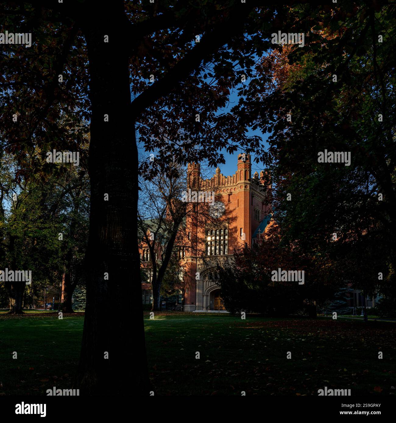 Sunrise on a university administration building from park Stock Photo ...