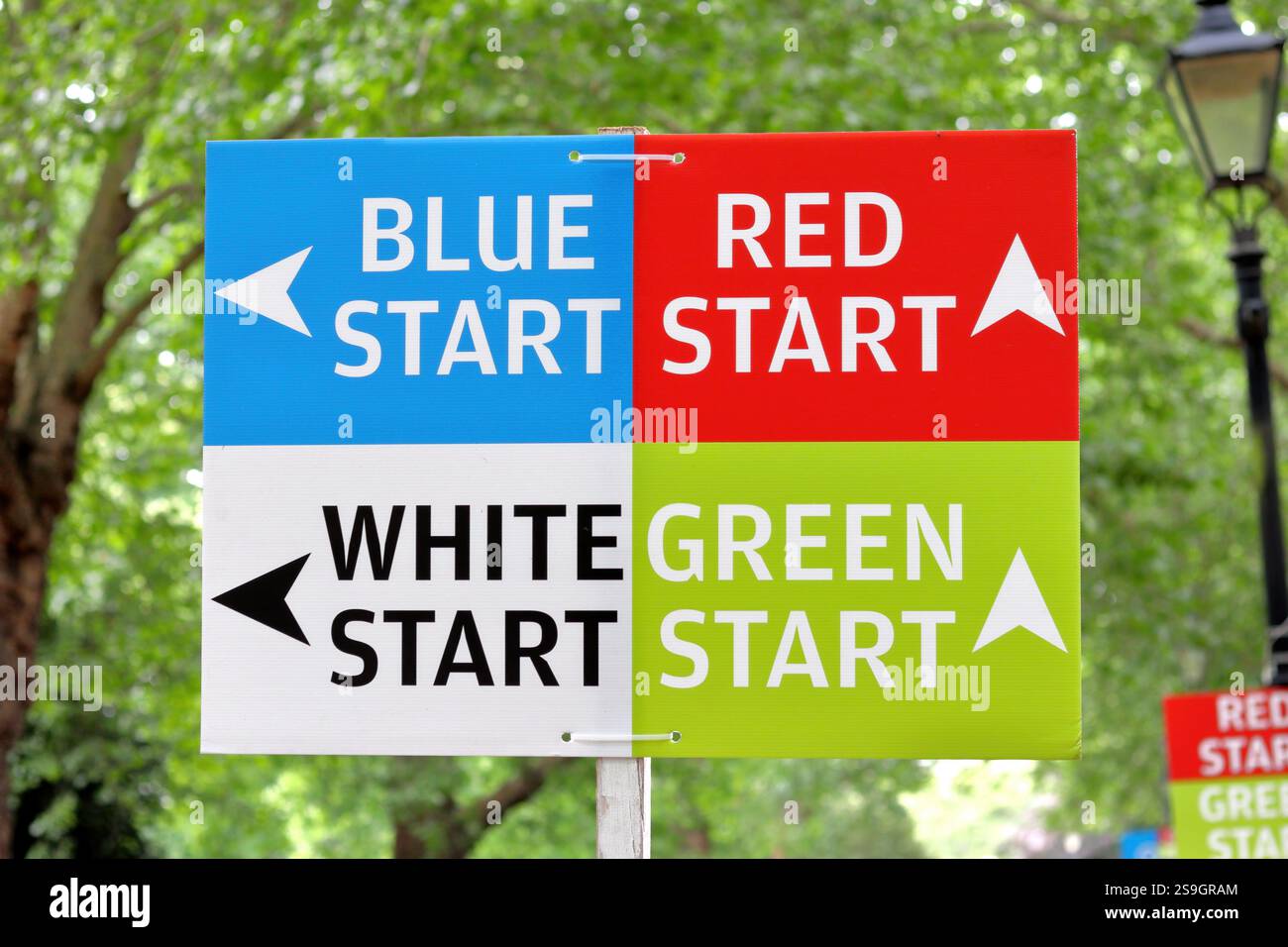 Board with arrows indicating directions to blue, white, red and green ...