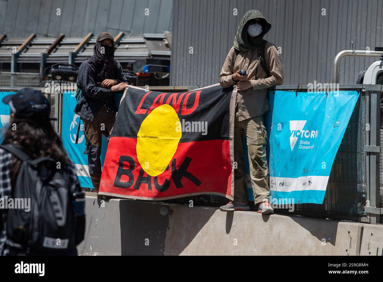 Protesters carry banners calling for land rights and truth-telling ...