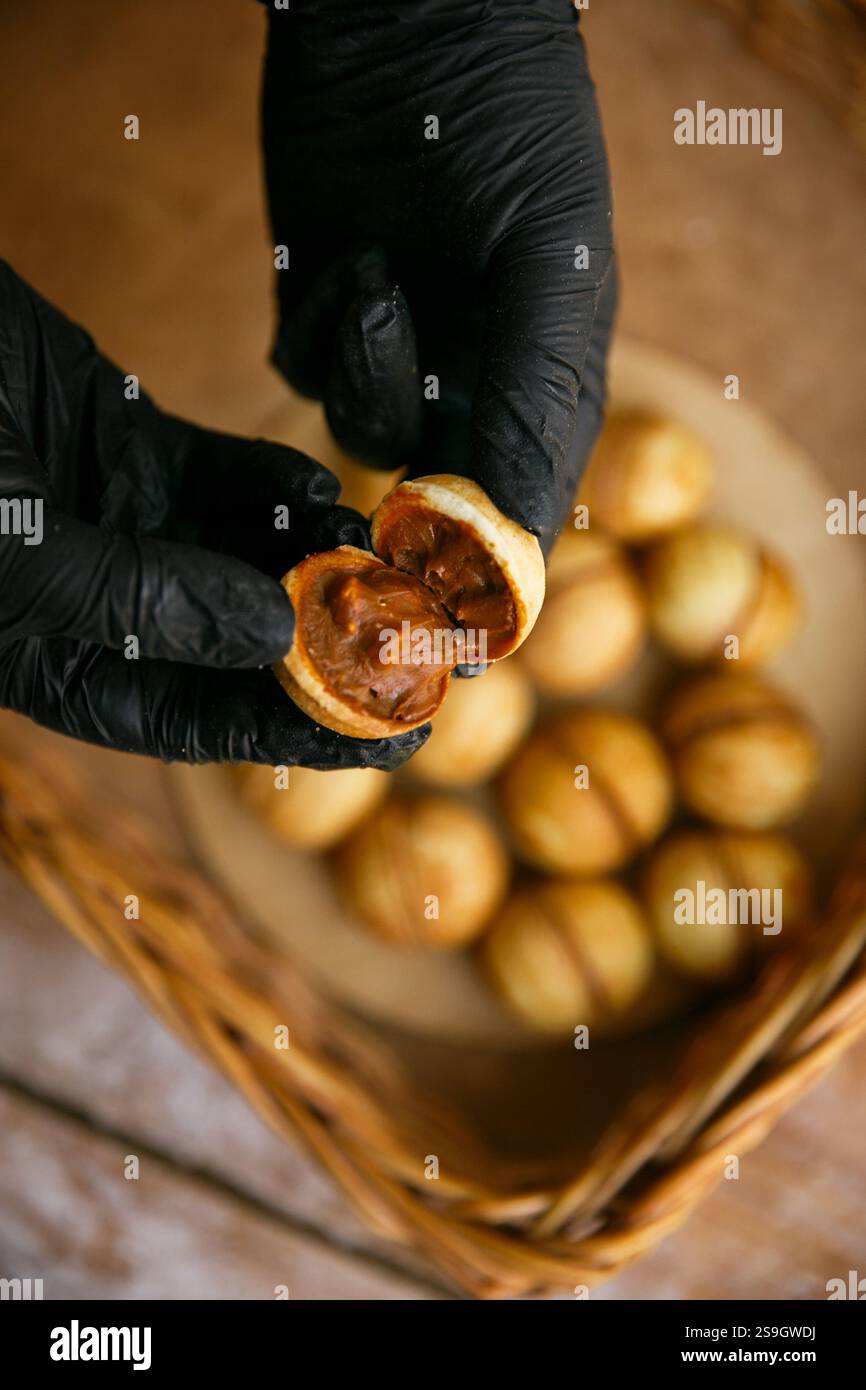 process of baking homemade nuts filled with condensed milk. A ...