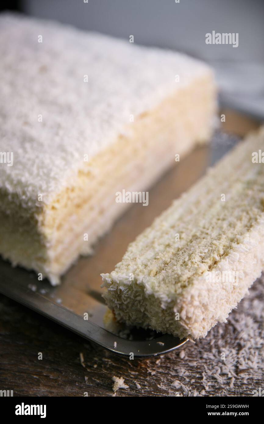 Delicious white Raffaello cake with coconut flakes Stock Photo - Alamy