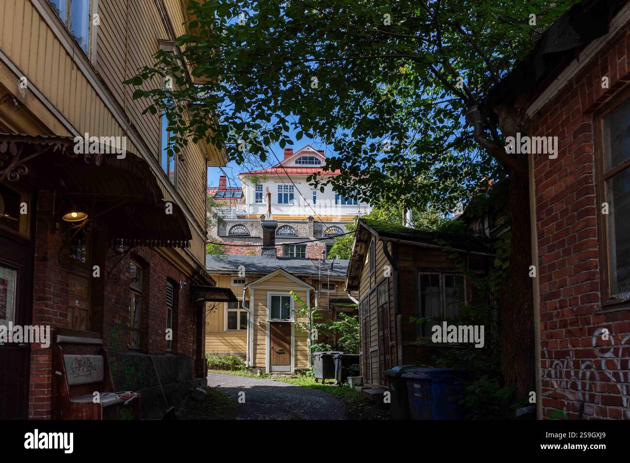 Inner courtyard of Kaskenkatu 3 with dilapidated wooden buildings in ...